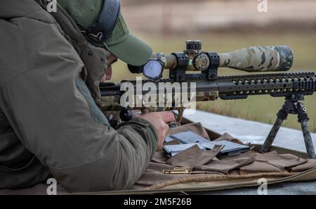 A Lithuanian Special Forces sniper conducts sniper range qualifications ...