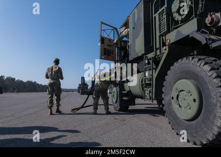 A Soldier from the 96th Transportation Company ground guides a Heavy ...