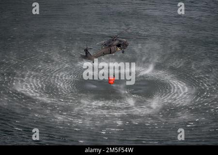 A UH-60 Blackhawk helicopter retrieves water from Kach’ang-josuji water ...