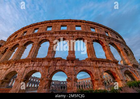 Pula Amphitheater at sunset, also known as Coliseum of Pula, is a well ...