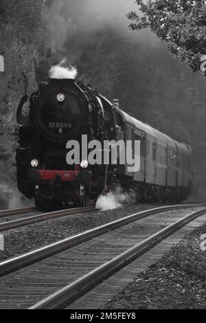 A vertical grayscale of a station with railways and trees around Stock ...