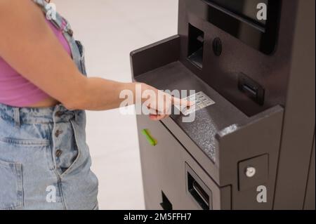 Faceless woman dialing bank card pin at ATM Stock Photo - Alamy