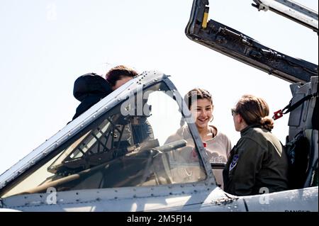 Capt. Taylor Bye and Air Force Chief of Staff Gen. CQ Brown, Jr. sing ...