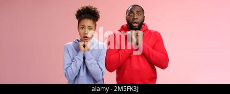 Upset worried two siblings watching together scary disturbing horror ...