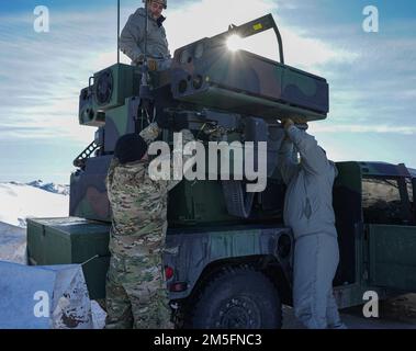 Soldiers with the 1-265th Air Defense Artillery (ADA), deliver aid to ...
