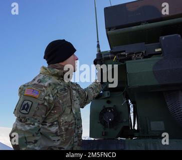 Soldiers with the 1-265th Air Defense Artillery (ADA), deliver aid to ...