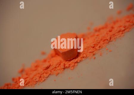 Orange pills with mdma ecstasy dope rolex drug close up background fine ...