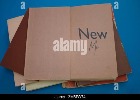 New Me word in opened book with vintage, natural patterns old antique ...