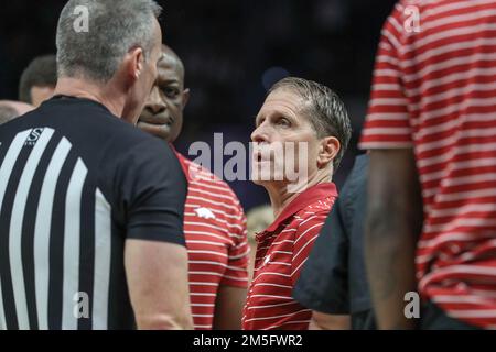 Arkansas coach Eric Musselman talks with an official on the sidelines ...