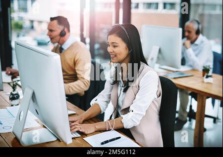 Young help desk operator working in office with many conflicting Stock ...