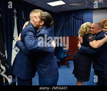 A colleague hugs Maj. Gen. Shawn Bratton after his promotion to major ...
