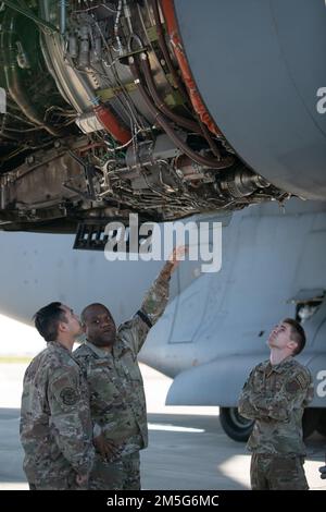 Air Force Master Sgt. Eric Martin (left), Tech. Sgt. Kyle Kikuchi ...