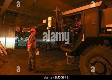 U.S. Marine Corps Cpl. Jason Warden, center, and Cpl. Simon Church ...