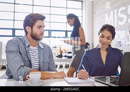 Theyre always hard at work. businesspeople using a digital tablet in an ...