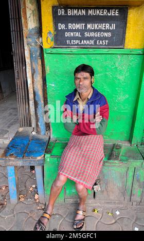 A smiling Bengali man dressed in a traditional lungi. Kolkata, India ...