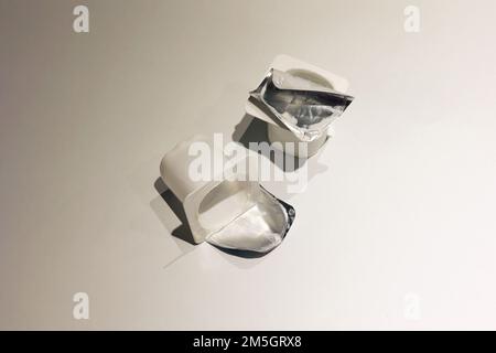 Empty yogurt cups with the lids Stock Photo - Alamy