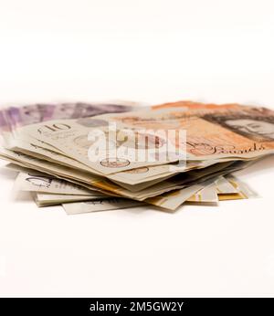 a few hundred pound of new GBP £ Sterling Ten 10 pound notes in a small ...