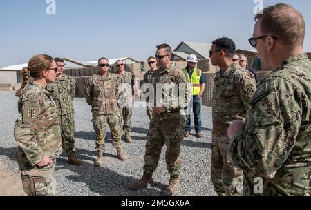 U.S. Army Lt. Col. Benjamin Neumon, left, an engineer officer assigned ...