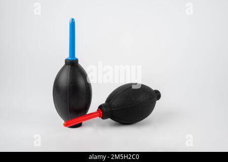 pair of air rocket type blowers and camera lenses on a white background ...