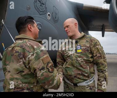 (From right to left) Col. Oscar W. Doward Jr., outgoing commander of ...