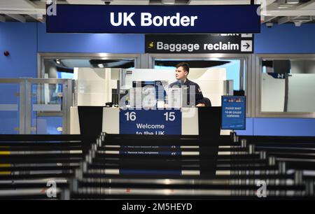 A member of the military at passport control at Manchester airport as ...
