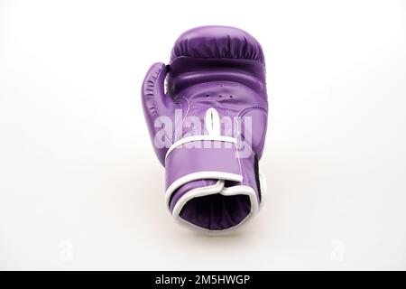 A single purple boxing glove isolated on a white background Stock Photo ...