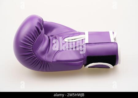 A single purple boxing glove isolated on a white background Stock Photo ...