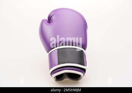 A single purple boxing glove isolated on a white background Stock Photo ...