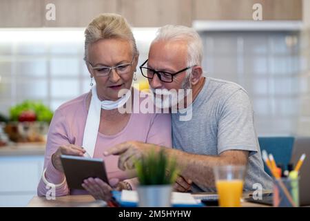 Senior couple at home,prepare bills to paying online. Online payment ...