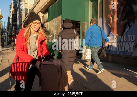 Schlepping her luggage in Chelsea in New York on Tuesday, December 20 ...