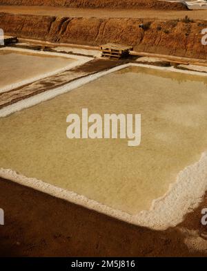 A vertical shot of Faro salt flats where sea salt is made and harvested ...