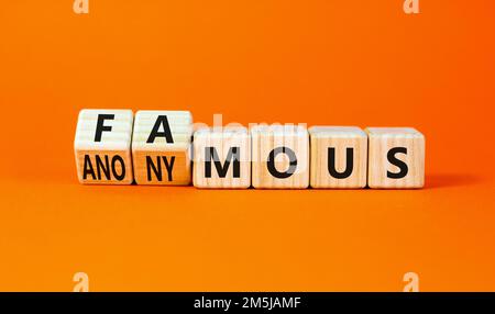 Famous or anonymous symbol. Concept word Famous and Anonymous on wooden ...