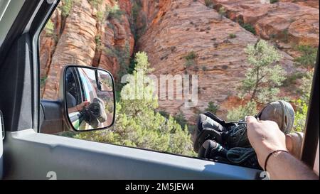 drying hiking boots from car window while driving Stock Photo - Alamy