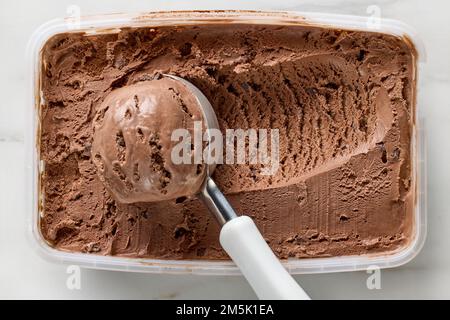 top view of chocolate in a box on orange background Stock Photo - Alamy