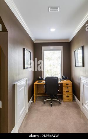 Stylish office chair near desk with computer in room. Interior design ...