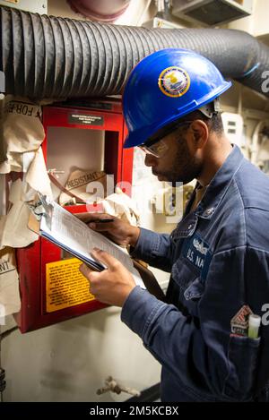 U.S. Navy Damage Controlman 3rd Class Jacob Bushman performs ...