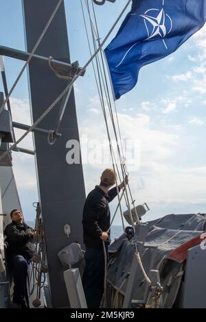 Petty Officer 3rd Class Jason Enoch leads his hose team during a fire ...