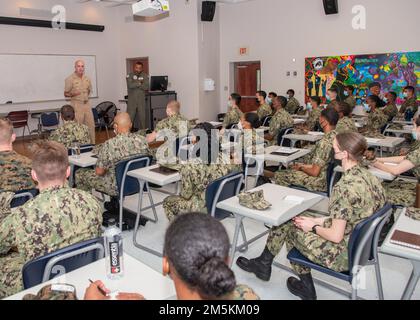 Navy Adm. Alvin Holsey, right, applauds as his wife Stephanie Holsey is ...