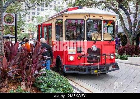 Passengers board the Downtown Trolley at a stop on Clematis Street in ...