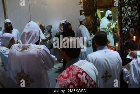 Coptic priests by the Coptic chapel in the back side of the Aedicule inside the church of the ...