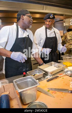 Air Force Master Sgt. and chef Opal Poullard, left, and Marine Corps ...
