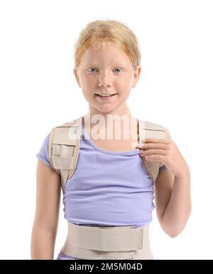 Little girl in back brace with bad and proper posture sitting on chair ...