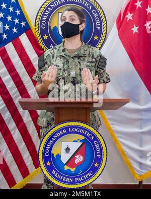 Naval Medical Forces Pacific Commander Rear Adm. Tim Weber returns a ...