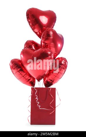Shopping bag with heart-shaped balloon for Valentine's Day on blue ...