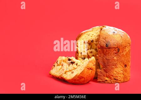 Cut Panettone on red background, top view Stock Photo - Alamy