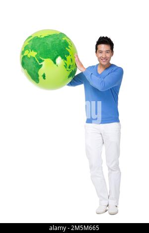 Creative green earth and young man Stock Photo - Alamy