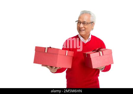 Shed older men with gift box Stock Photo - Alamy