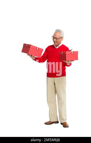 Shed older men with gift box Stock Photo - Alamy