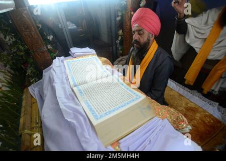 Peshawar, Pakistan. 28th Dec, 2022. Sikh devotees take part in a ...