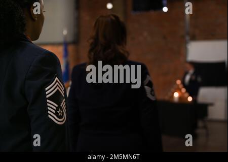 Candles representing each enlisted rank are lit on a podium during a ...